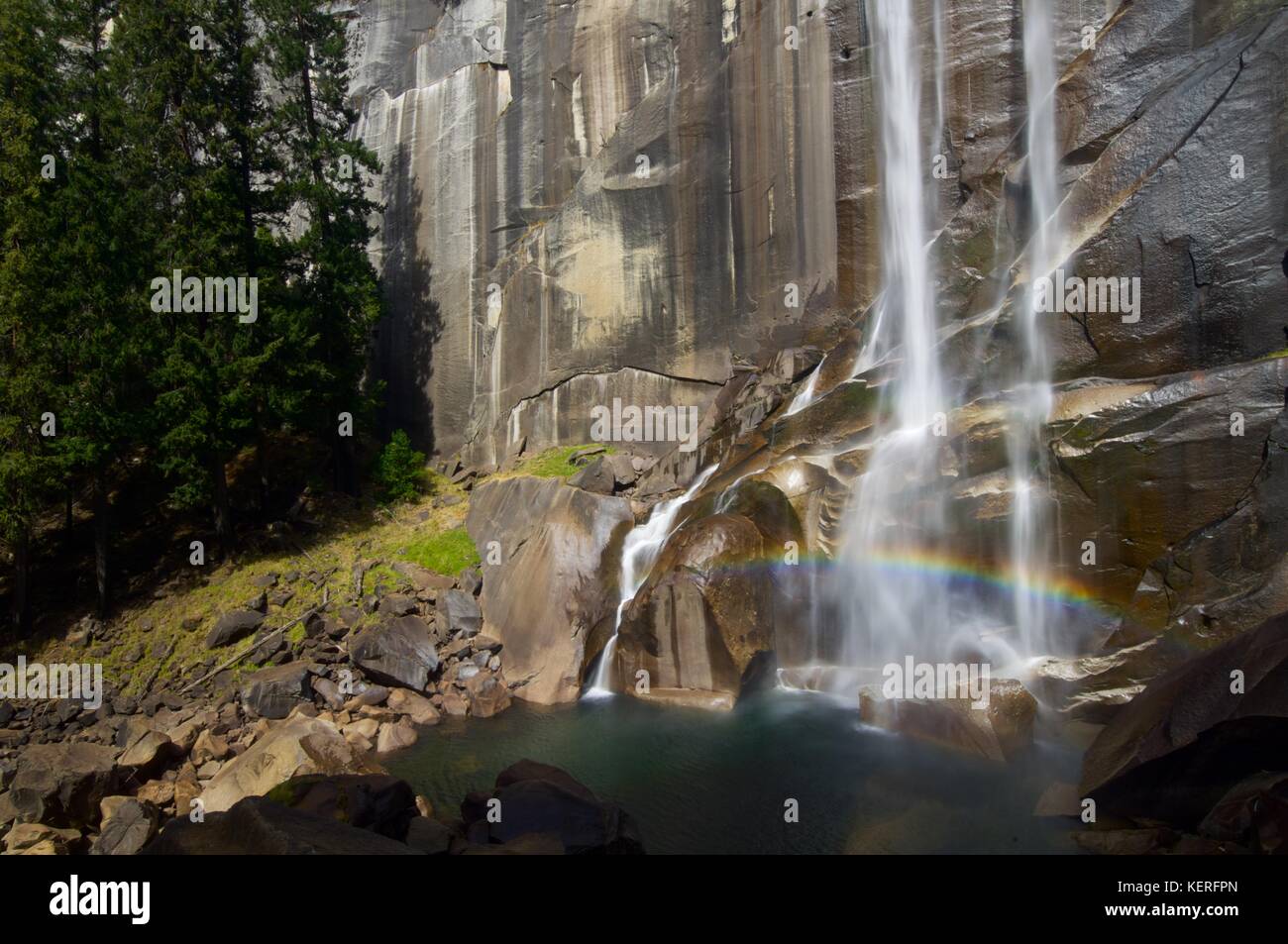 Waterfall known as Vernal Fall falling on a smooth wall of granite in ...