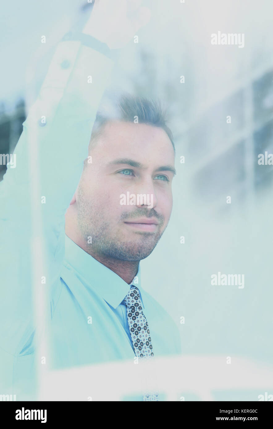 business man looking through window Stock Photo - Alamy