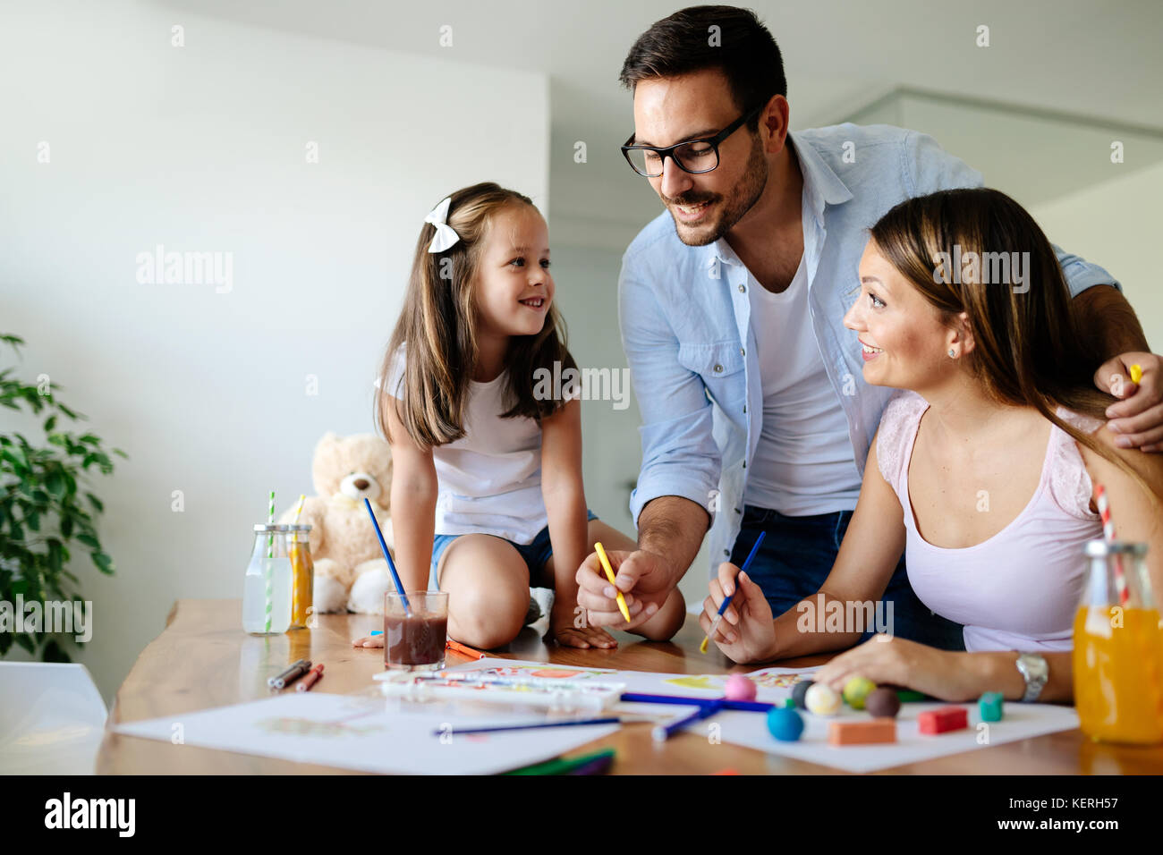 Happy familiy spending fun time at home Stock Photo - Alamy