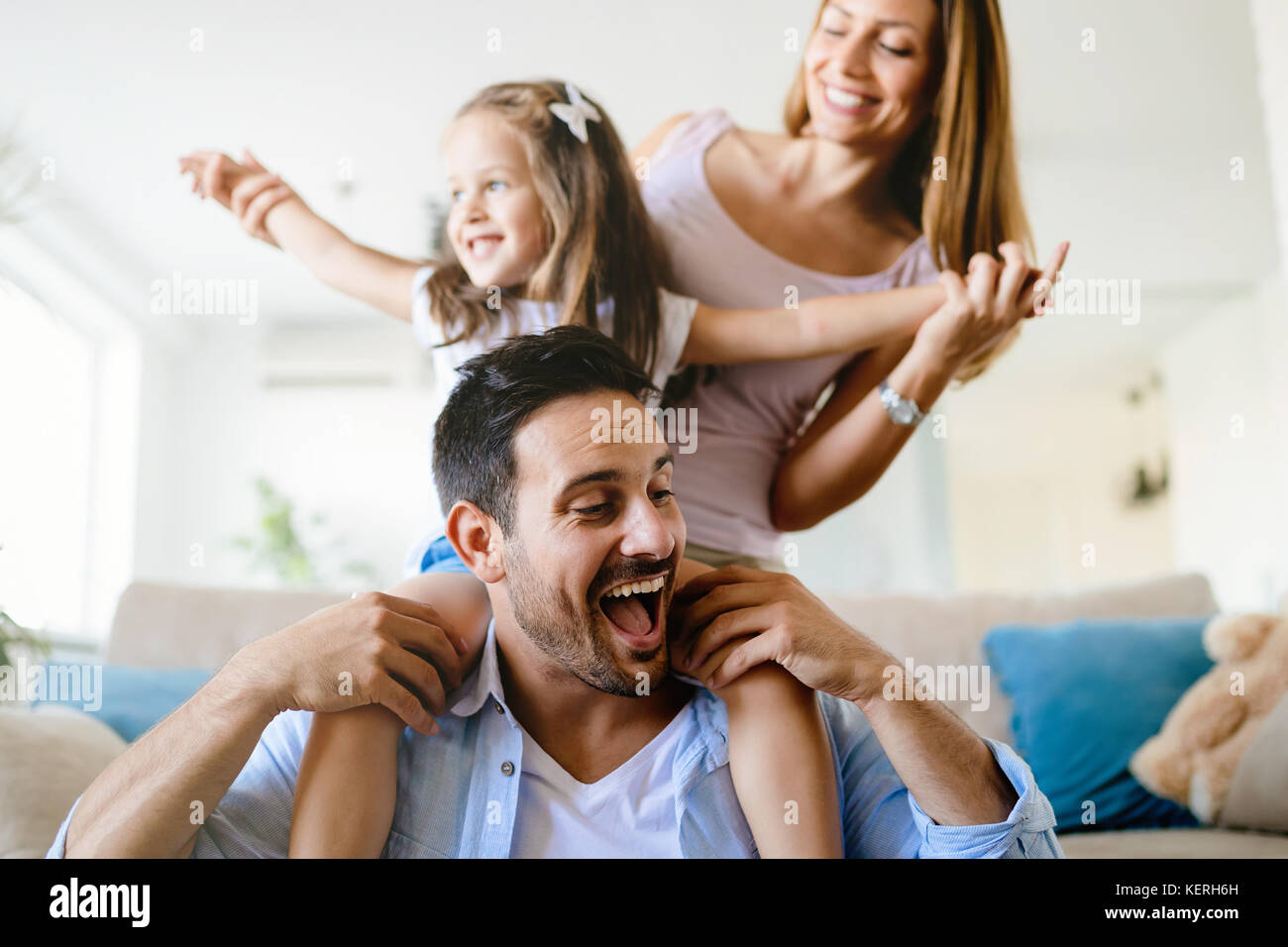 Happy family having fun times at home Stock Photo - Alamy