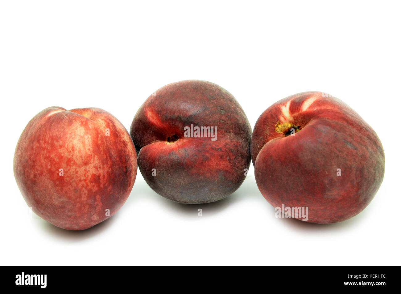 Three peach isolated on a white background Stock Photo - Alamy