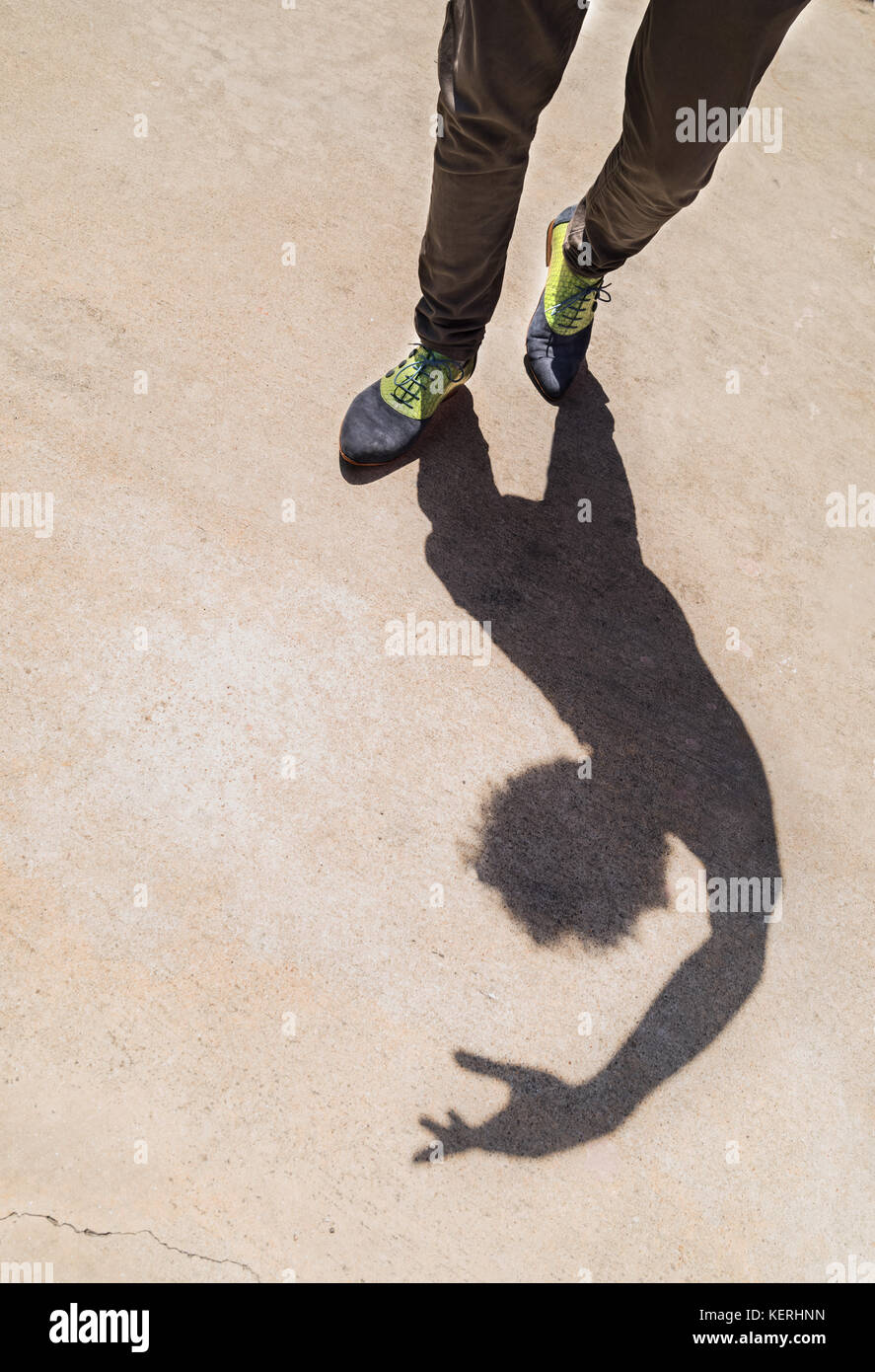 Detail of shoes and shadows Stock Photo - Alamy