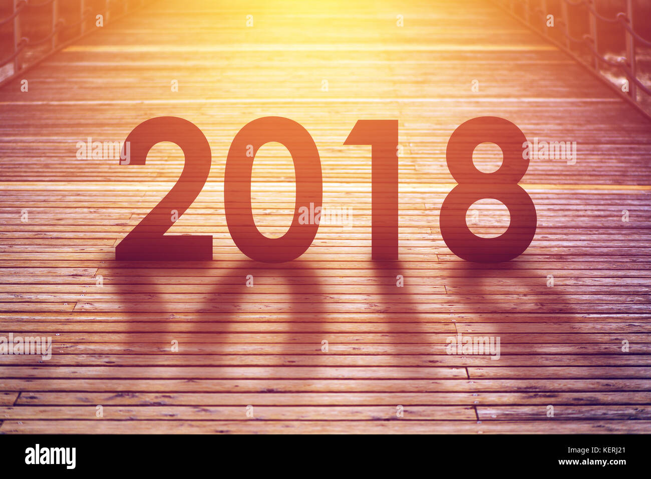 Sunset sunlight shining on number 2018 on wooden pier boardwalk at the ...