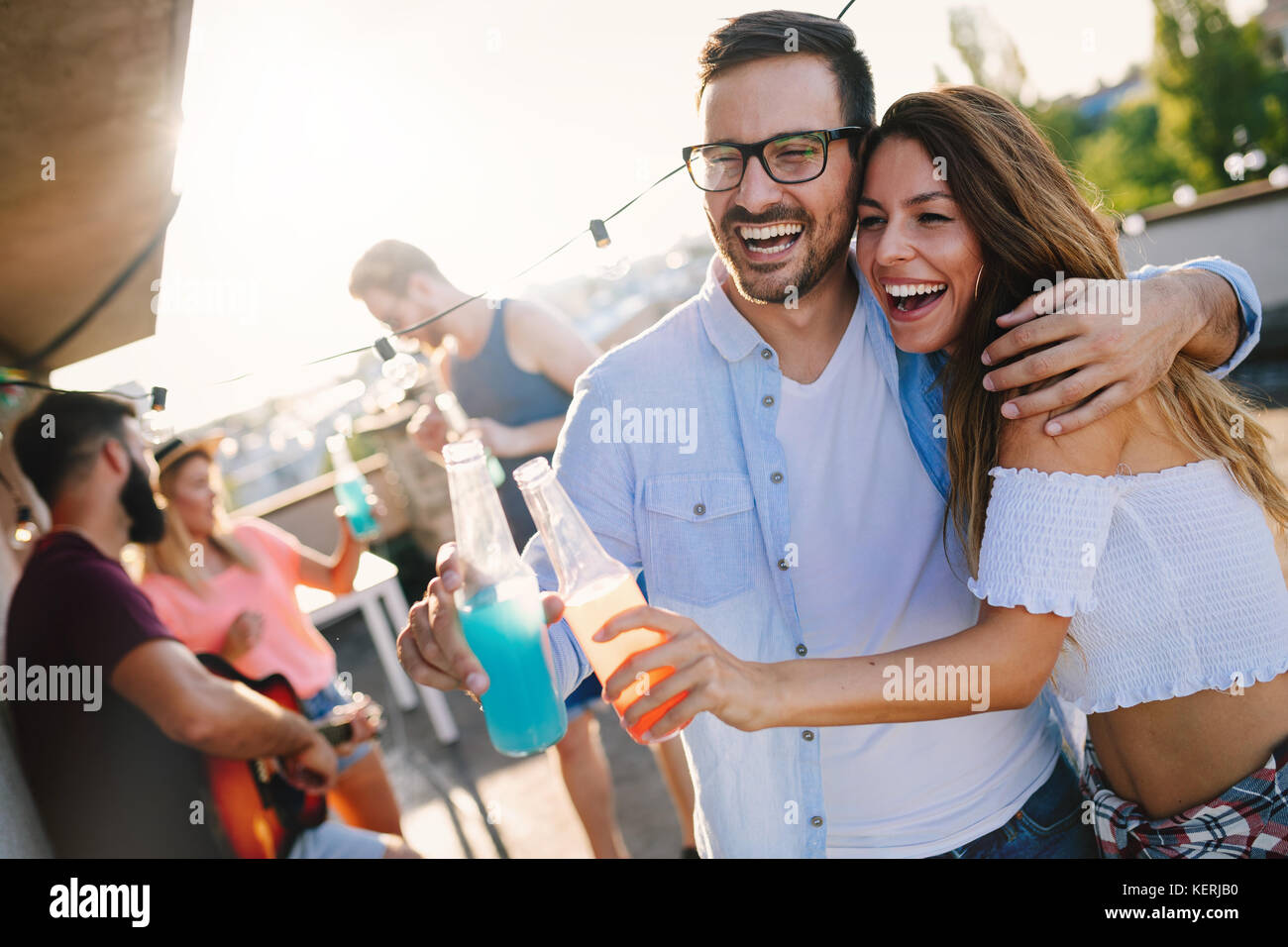 Happy couple having fun time at party Stock Photo - Alamy