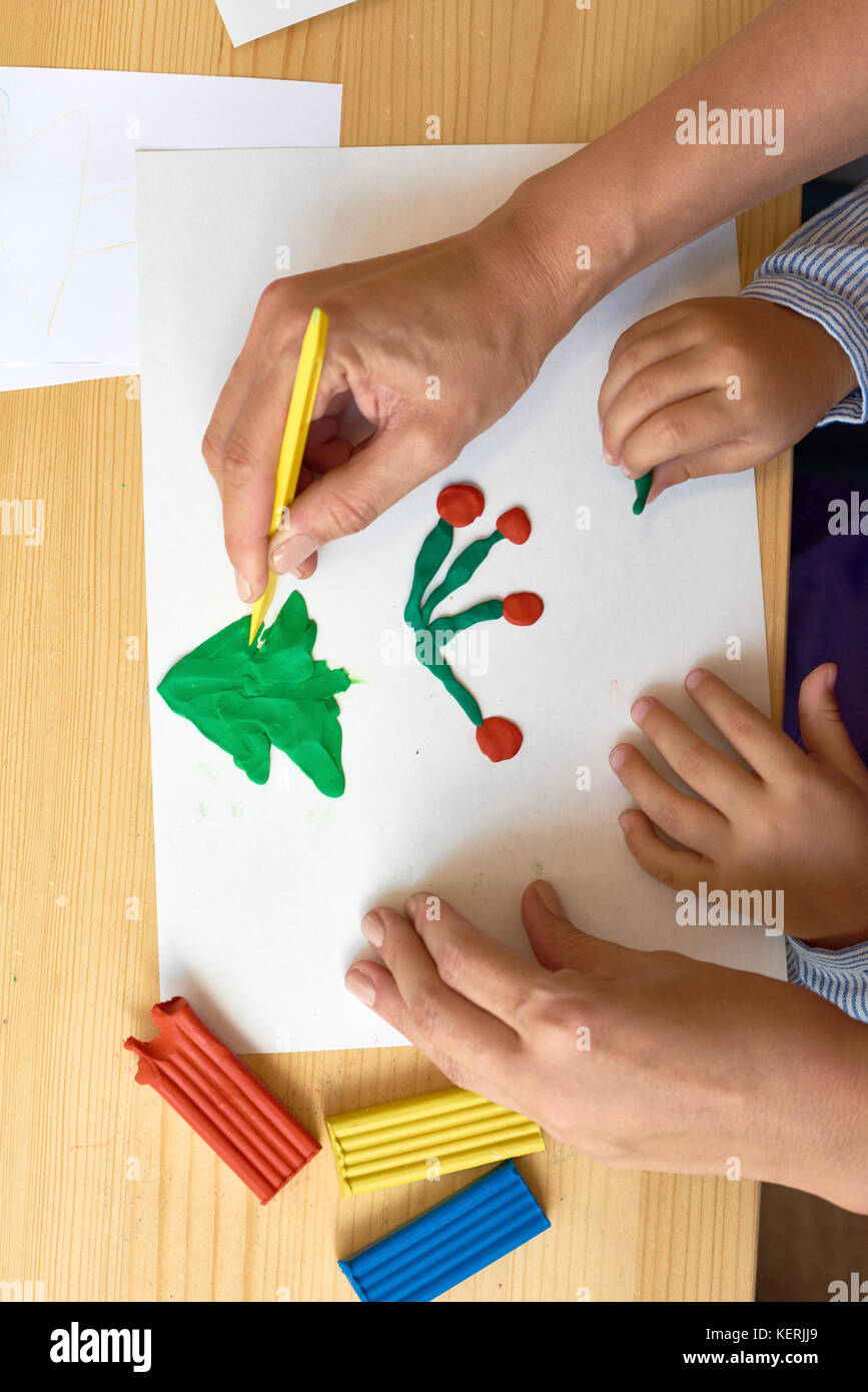 Parent and Child Making Christmas Crafts Stock Photo - Alamy