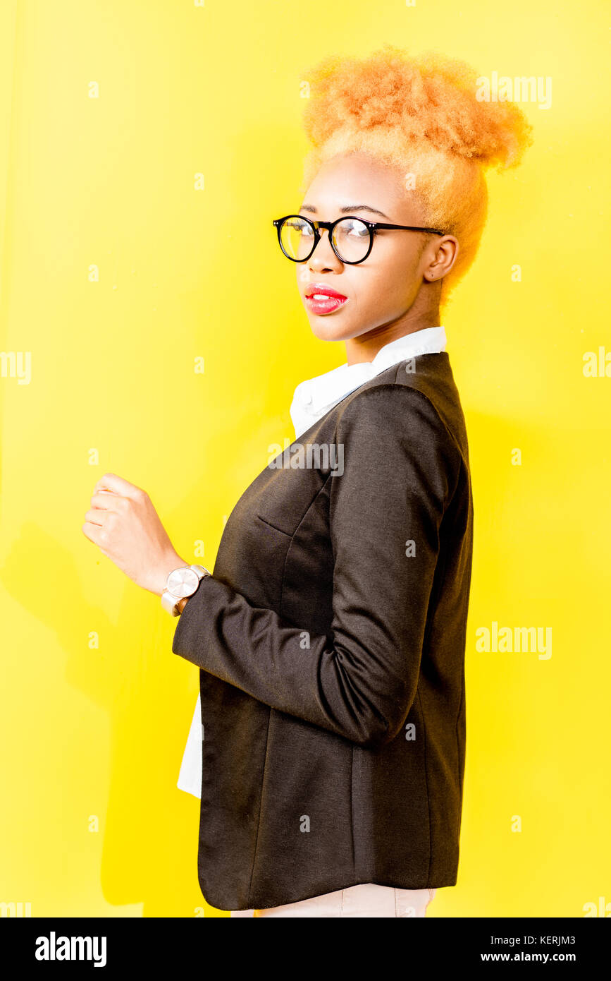 Portrait of an african business lady on the yellow background Stock ...