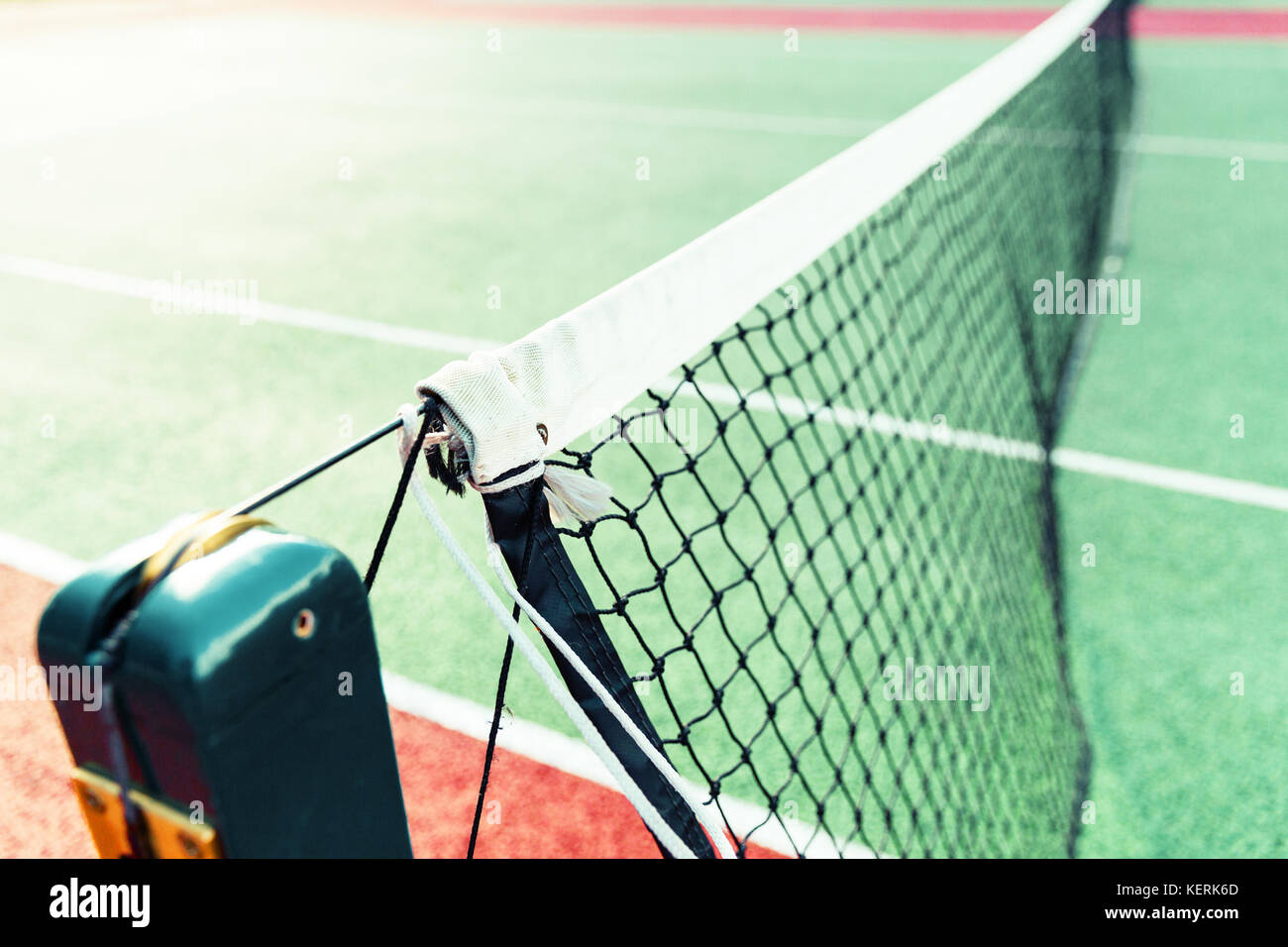 Green tennis court net in sunlight Stock Photo - Alamy