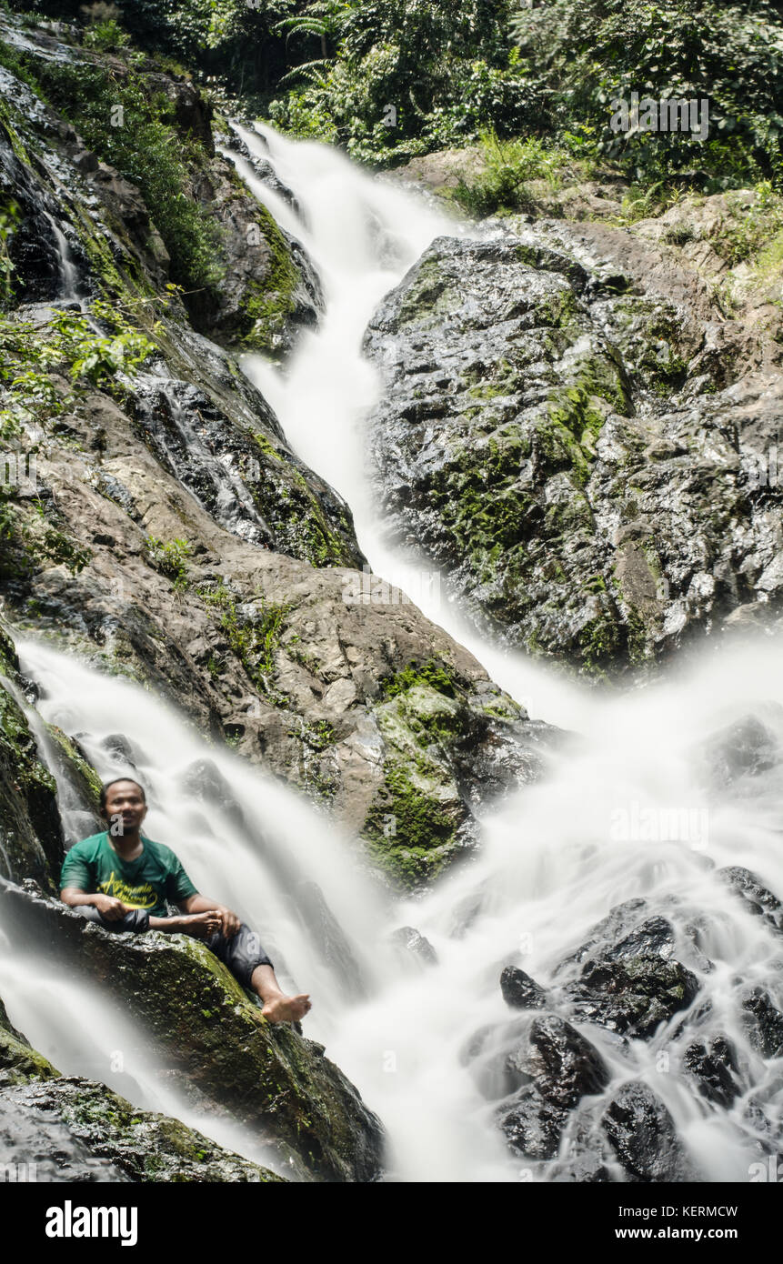 Man sitting waterfall enjoying nature hi-res stock photography and ...