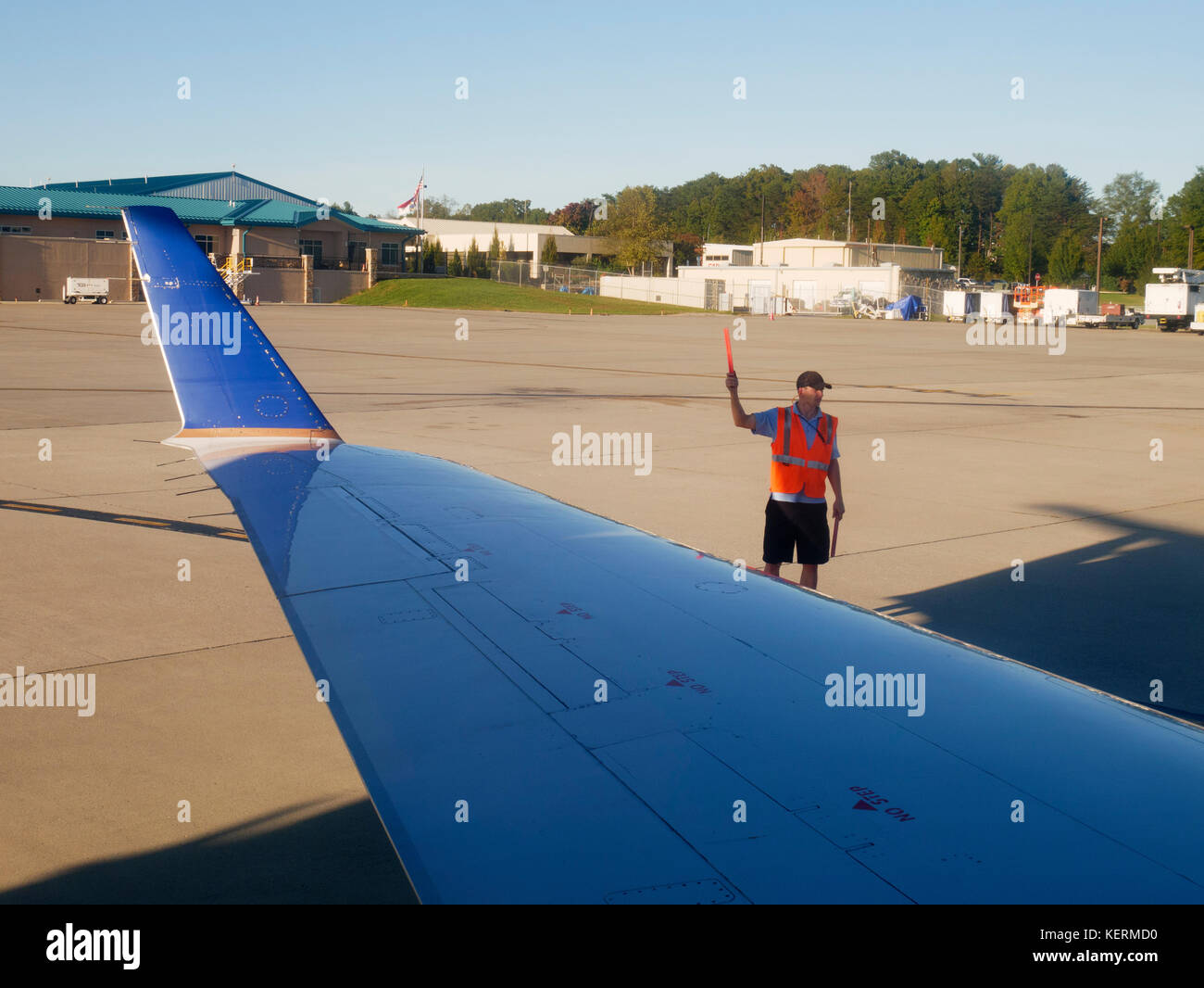Ground crewman guiding aircraft Stock Photo - Alamy