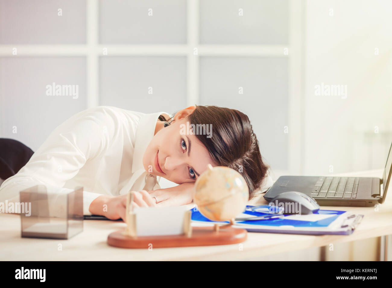 tired woman at office desk in the evening Stock Photo - Alamy