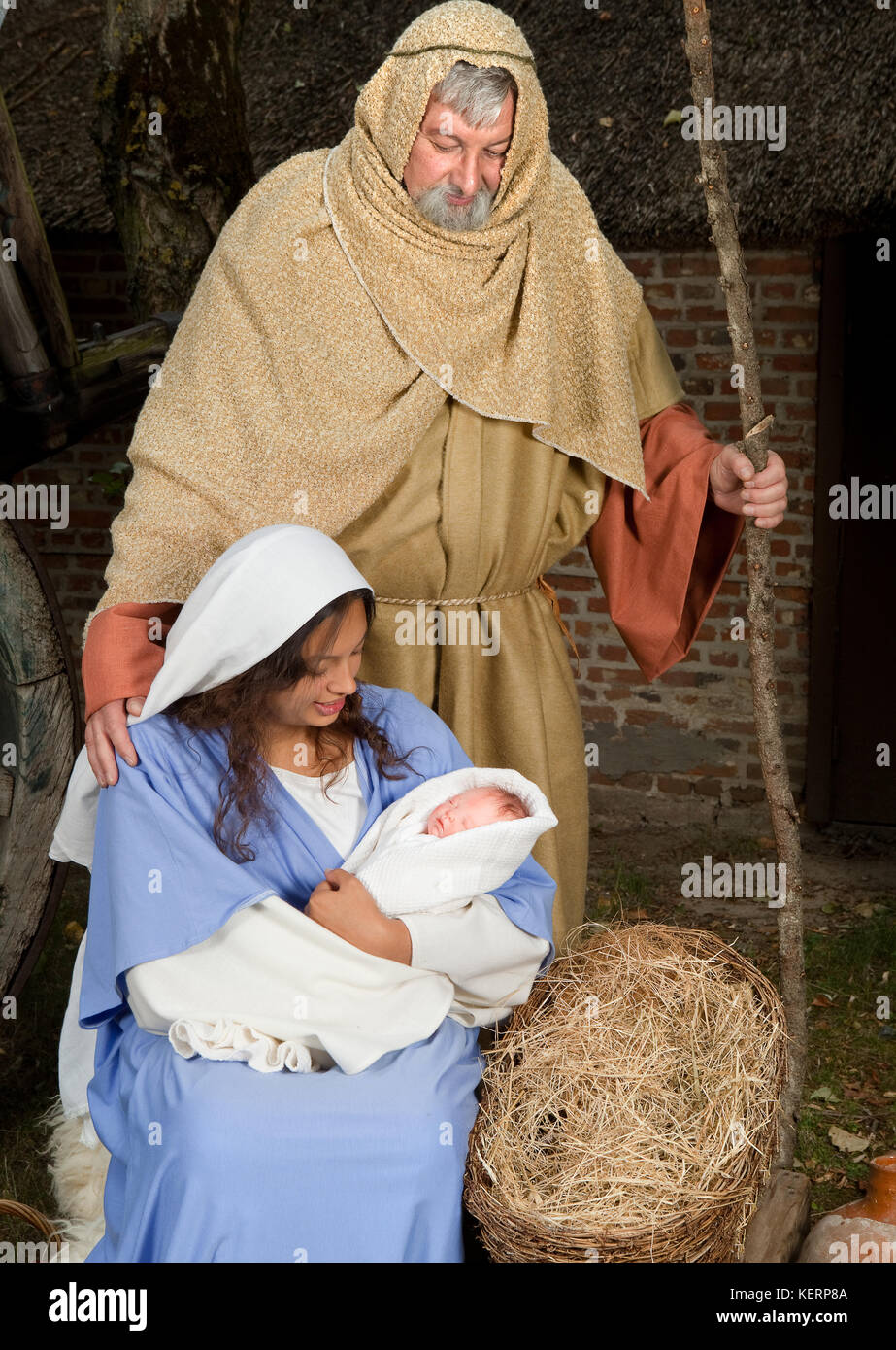 Live Christmas nativity scene reenacted in a medieval barn Stock Photo ...