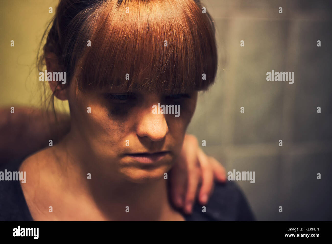 Mirror reflection of sad, depressed woman, with someone's hand on her ...