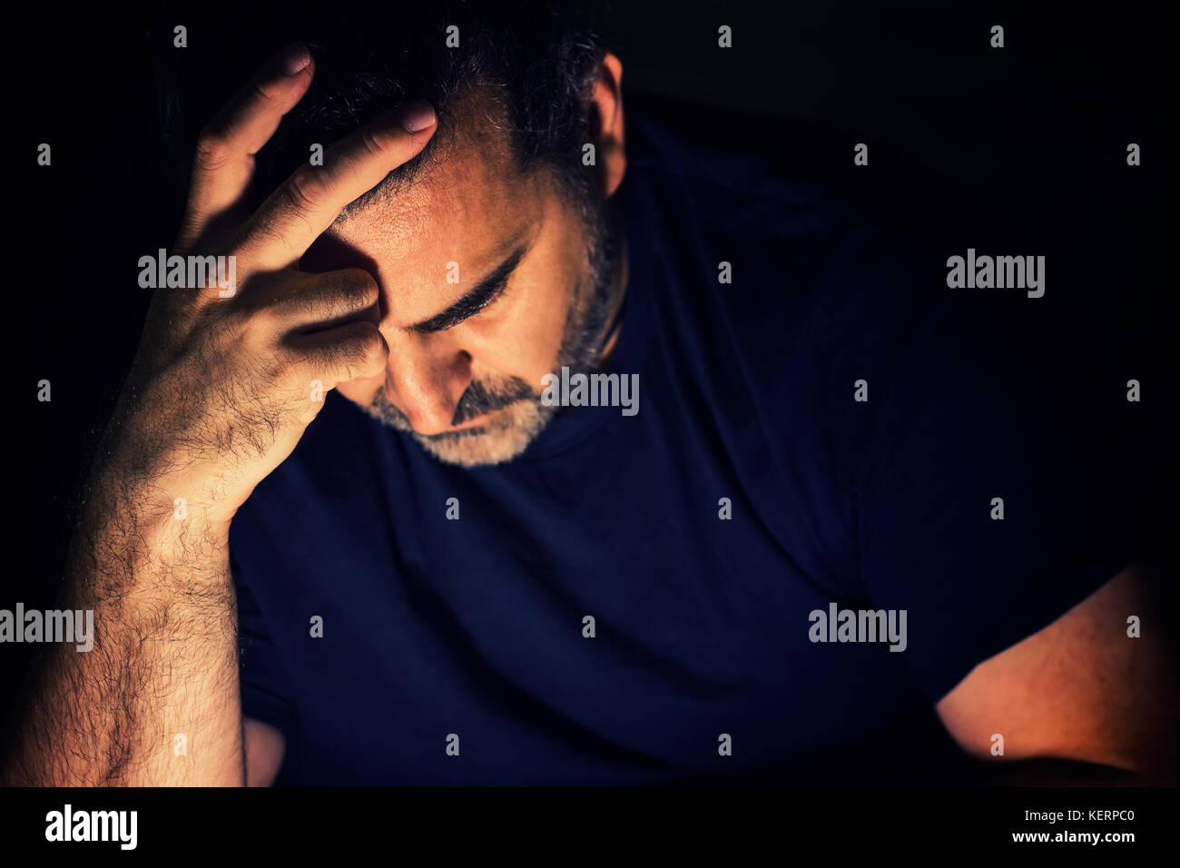 Worried lonely man with one hand on his forehead Stock Photo - Alamy