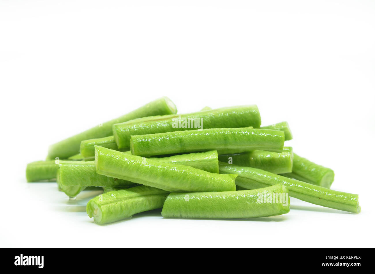 Chopped long beans isolated on white background Stock Photo - Alamy