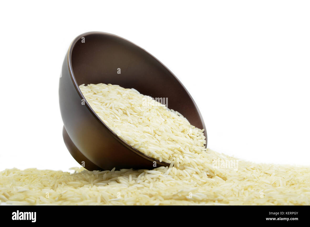 White basmati rice with wooden bowl. Close up Stock Photo - Alamy