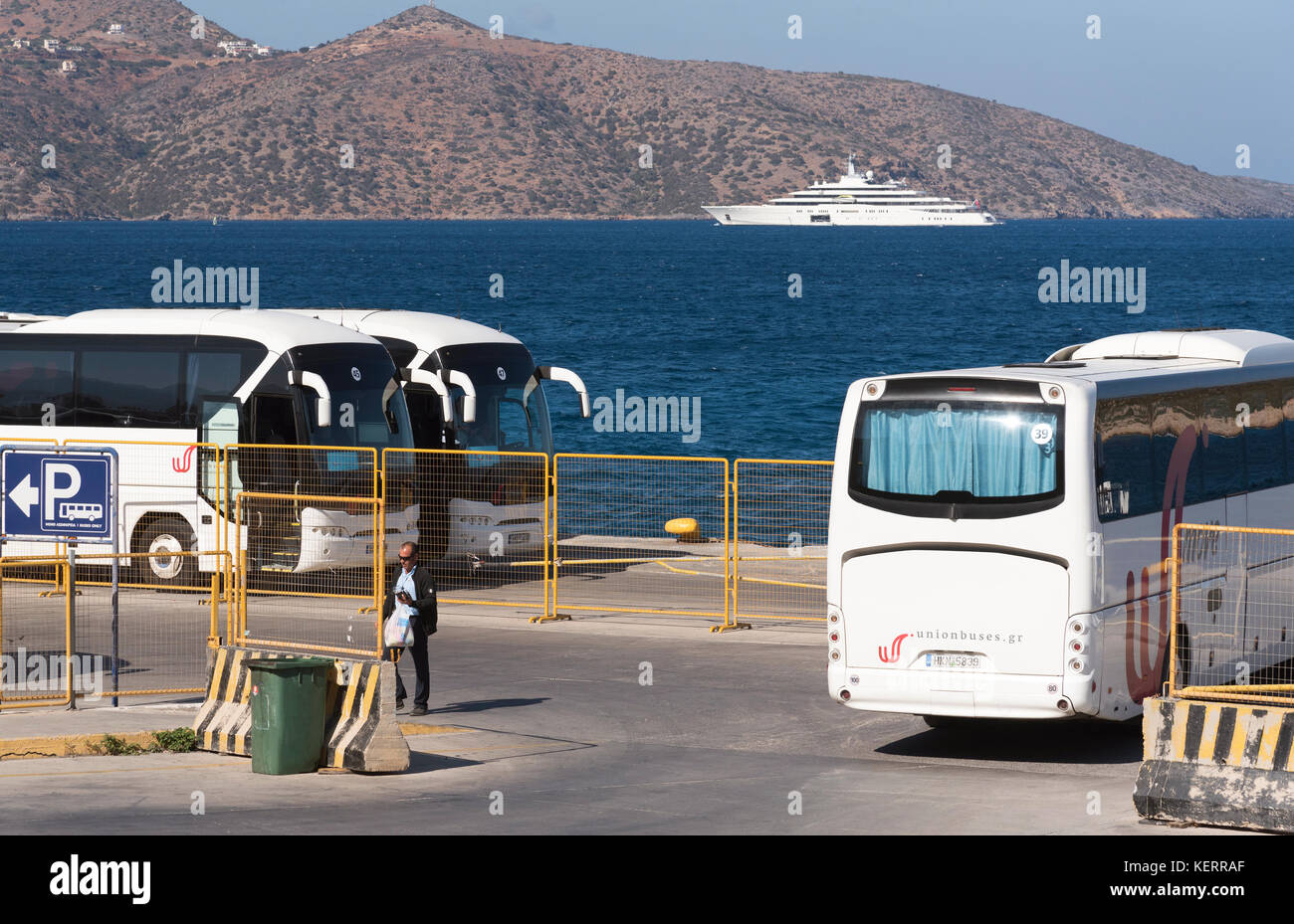 Agios Nikolaos, Crete, Greece. Bus and touist coach park on the harbour ...