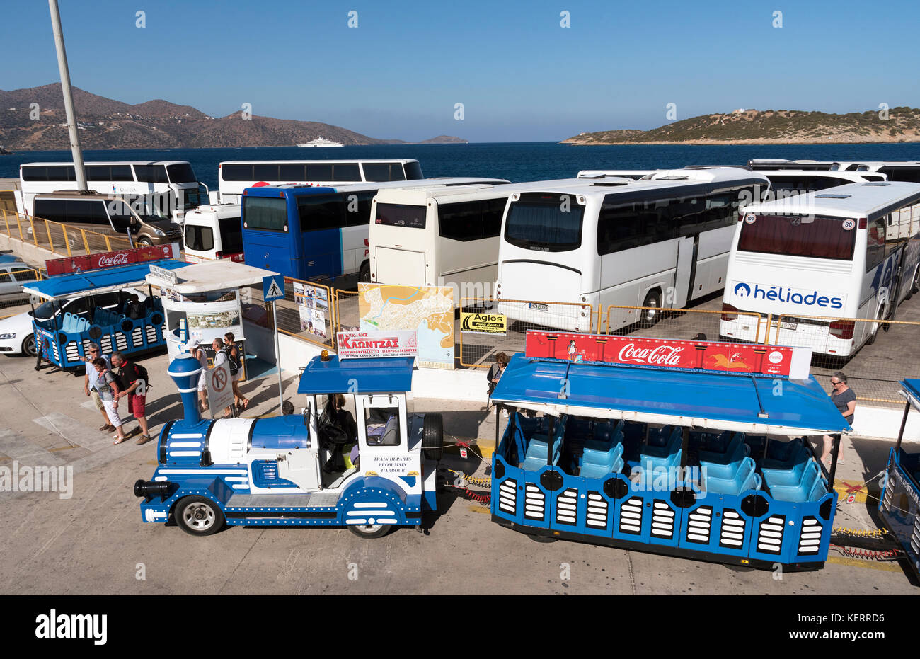 Agios Nikolaos, Crete, Greece. Bus and touist coach park on the harbour ...