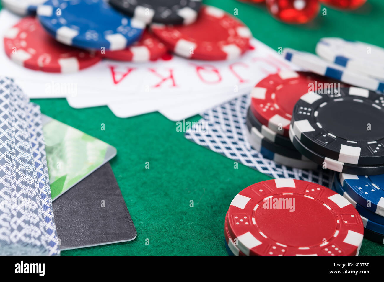 winning combinations of cards on a green poker table, bank cards to pay ...