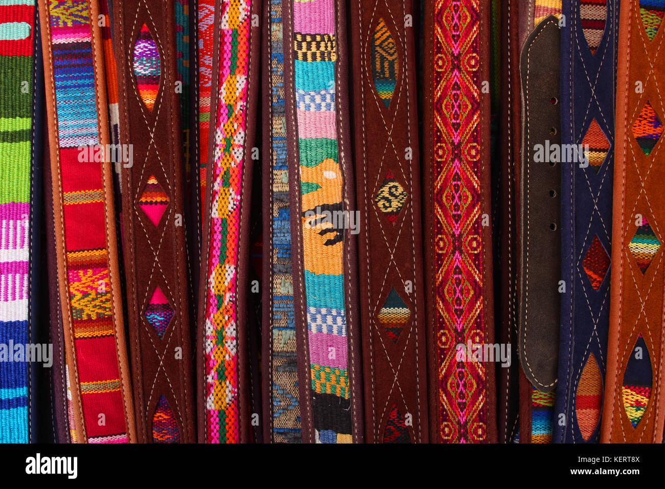 Handmade colorful cloth and leather belts for sale at the outdoor craft ...