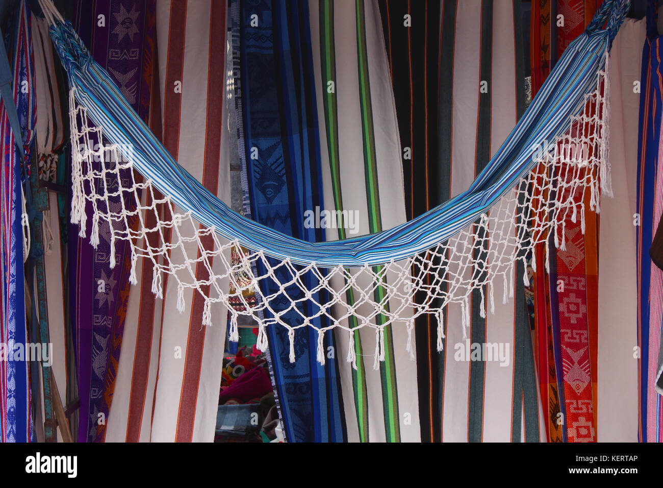 Colorful hammocks for sale at the outdoor craft market in Otavalo ...