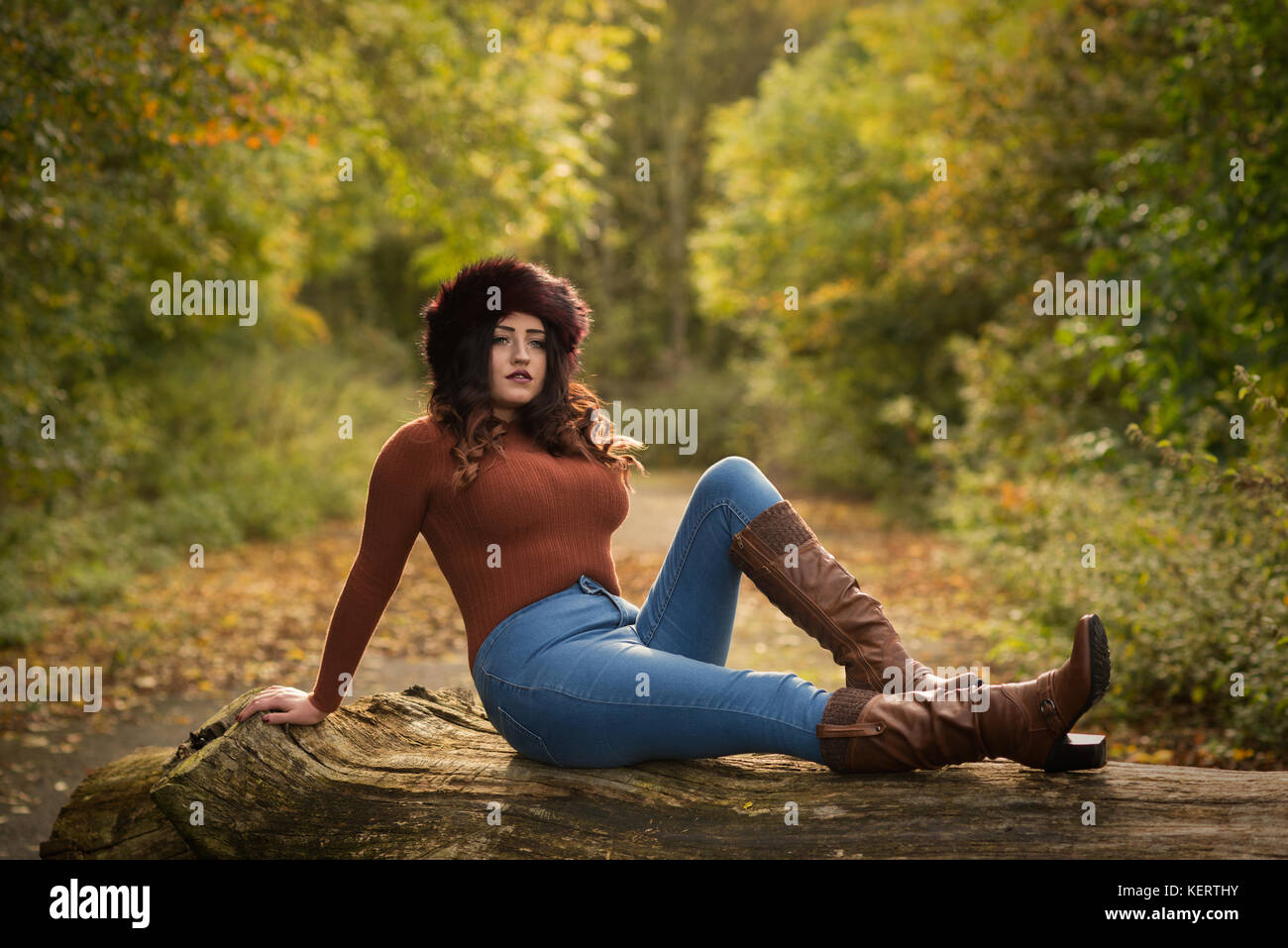 Woman sitting on leaves hi-res stock photography and images - Alamy