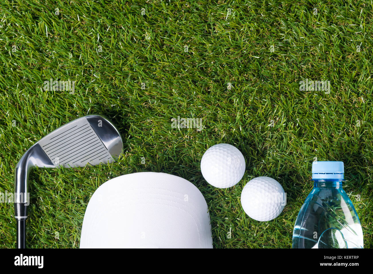 Set of golf on a background of green grass Stock Photo - Alamy