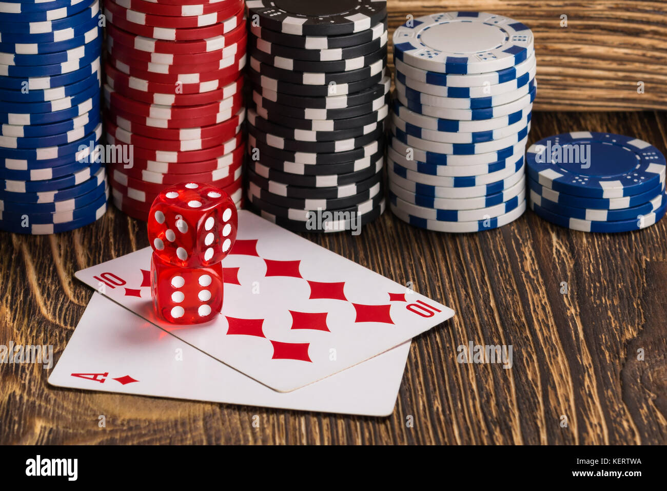 Poker cards with cubes are beautifully placed on the table, against the ...