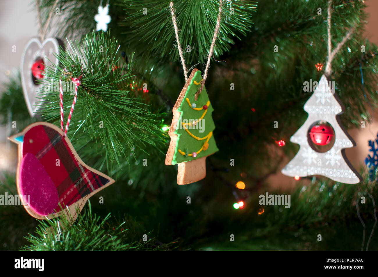 A cookie and wooden toys in the form of a Christmas tree and heart and ...