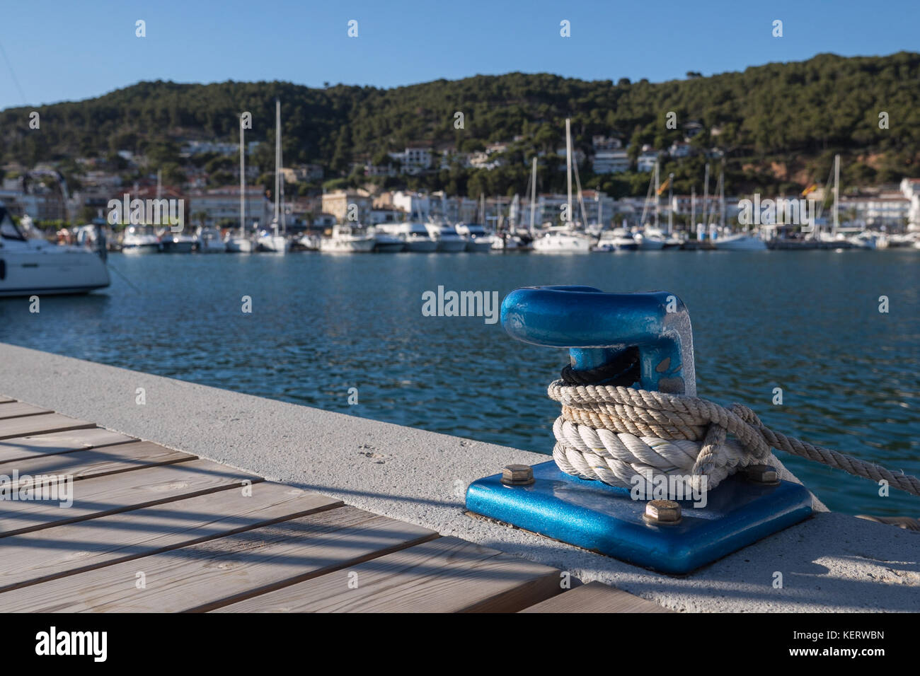 Closeup of a bollard with ropes in the port of Estartit on the Costa ...