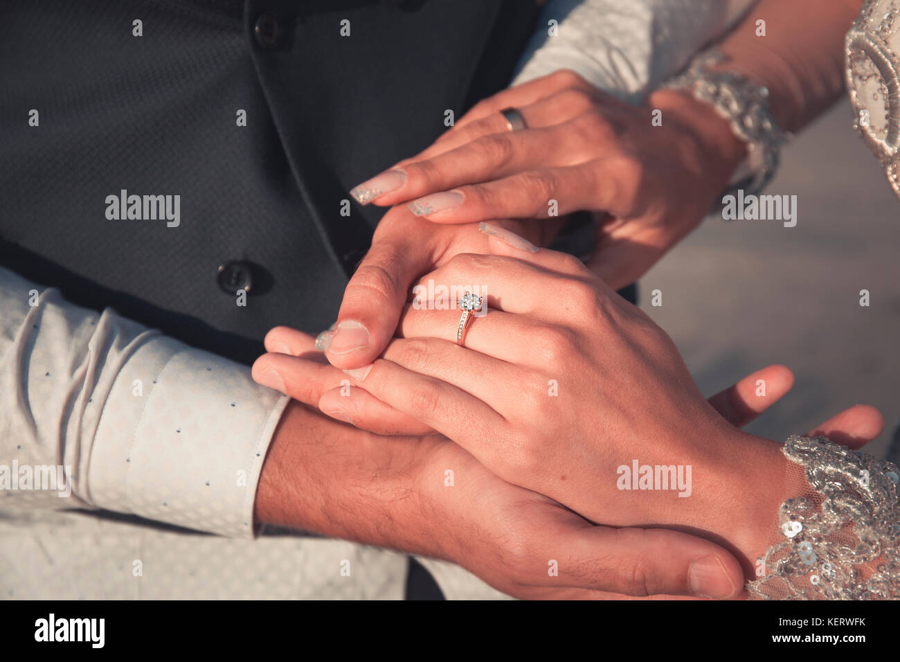 wedding couple holding hands, groom and bride Stock Photo - Alamy
