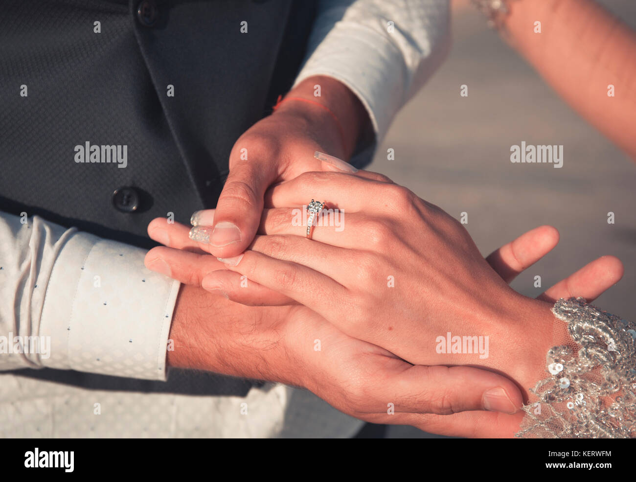 wedding couple holding hands, groom and bride Stock Photo - Alamy
