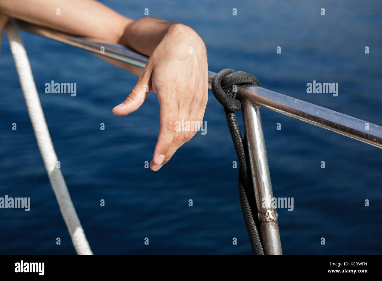 hand on railing of yacht against background of sea Stock Photo - Alamy