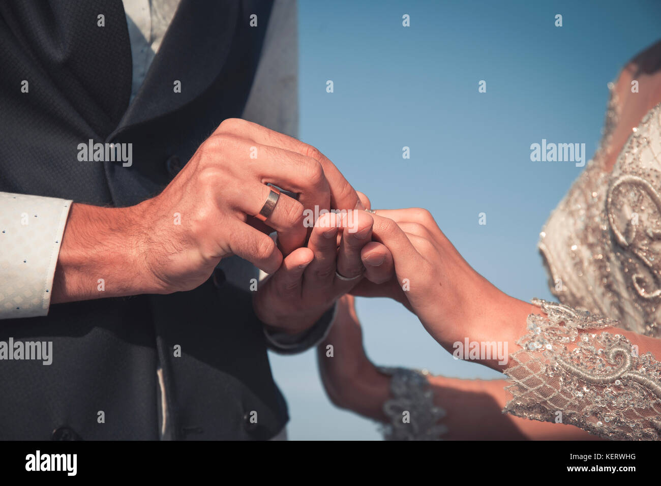 wedding couple holding hands, groom and bride Stock Photo - Alamy