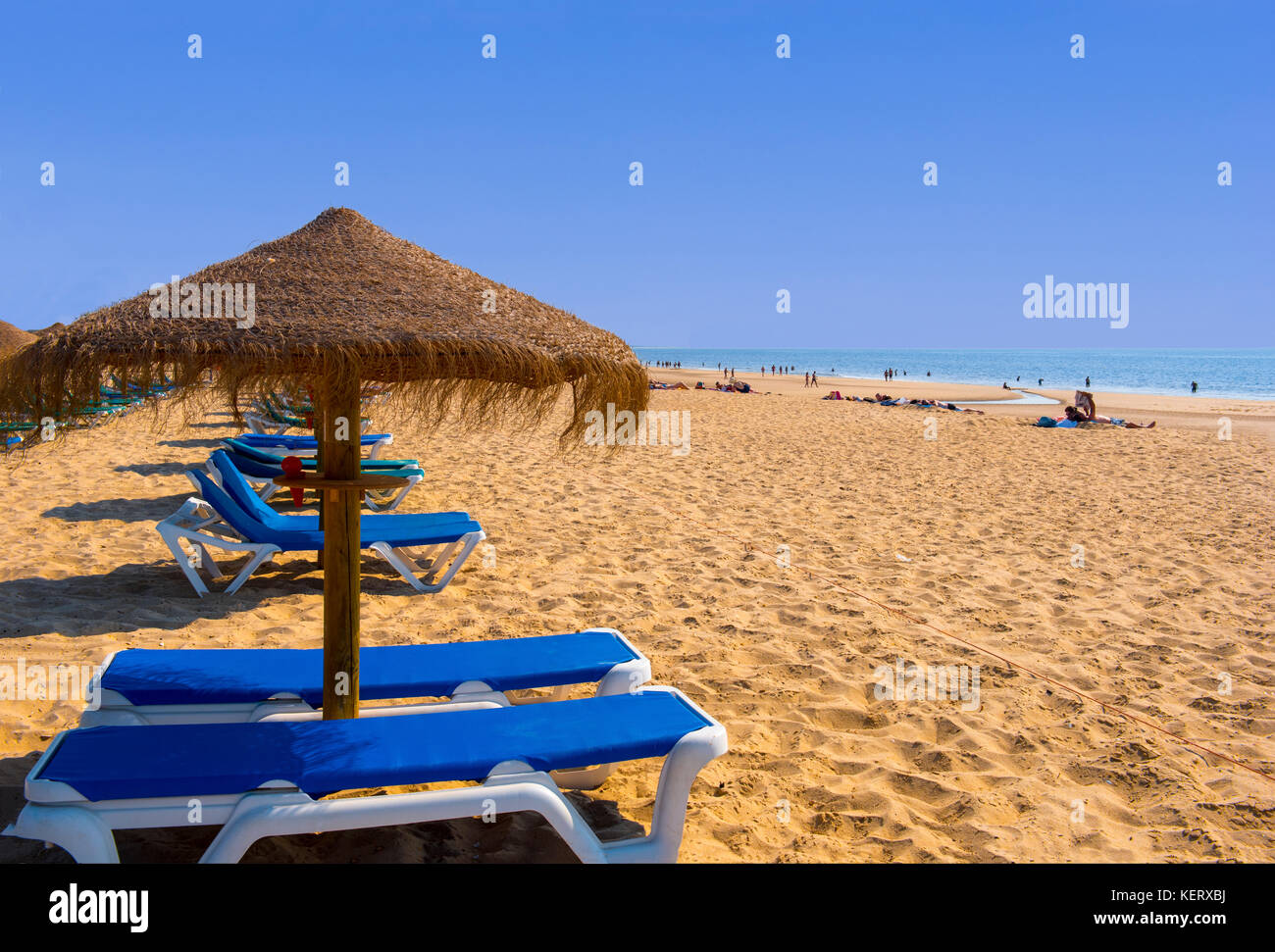 Expansive sandy Beach at Manta Rota Eastern Algarve showing thatched ...