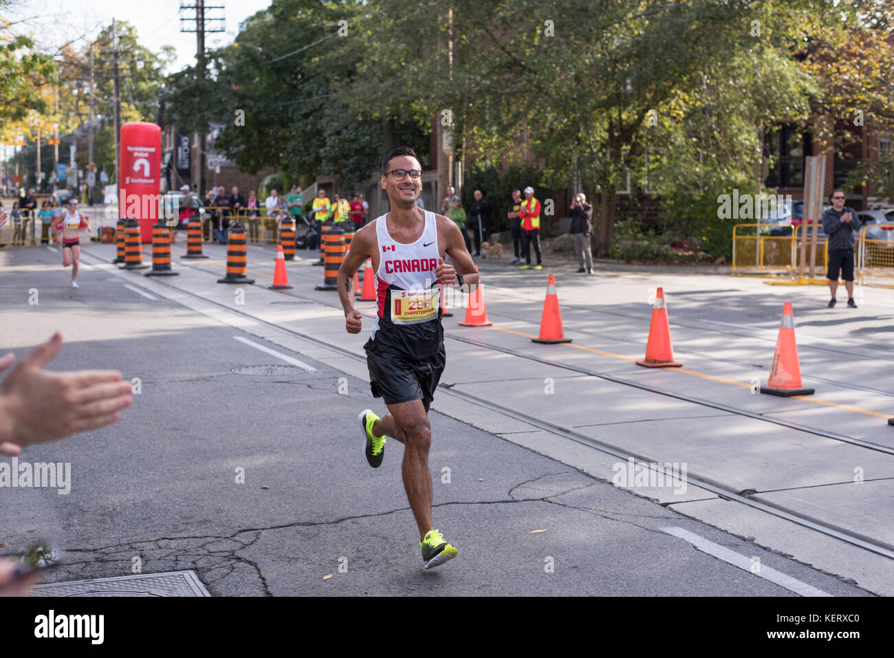 TORONTO, ON/CANADA - OCT 22, 2017: Marathon runner Christopher passing ...