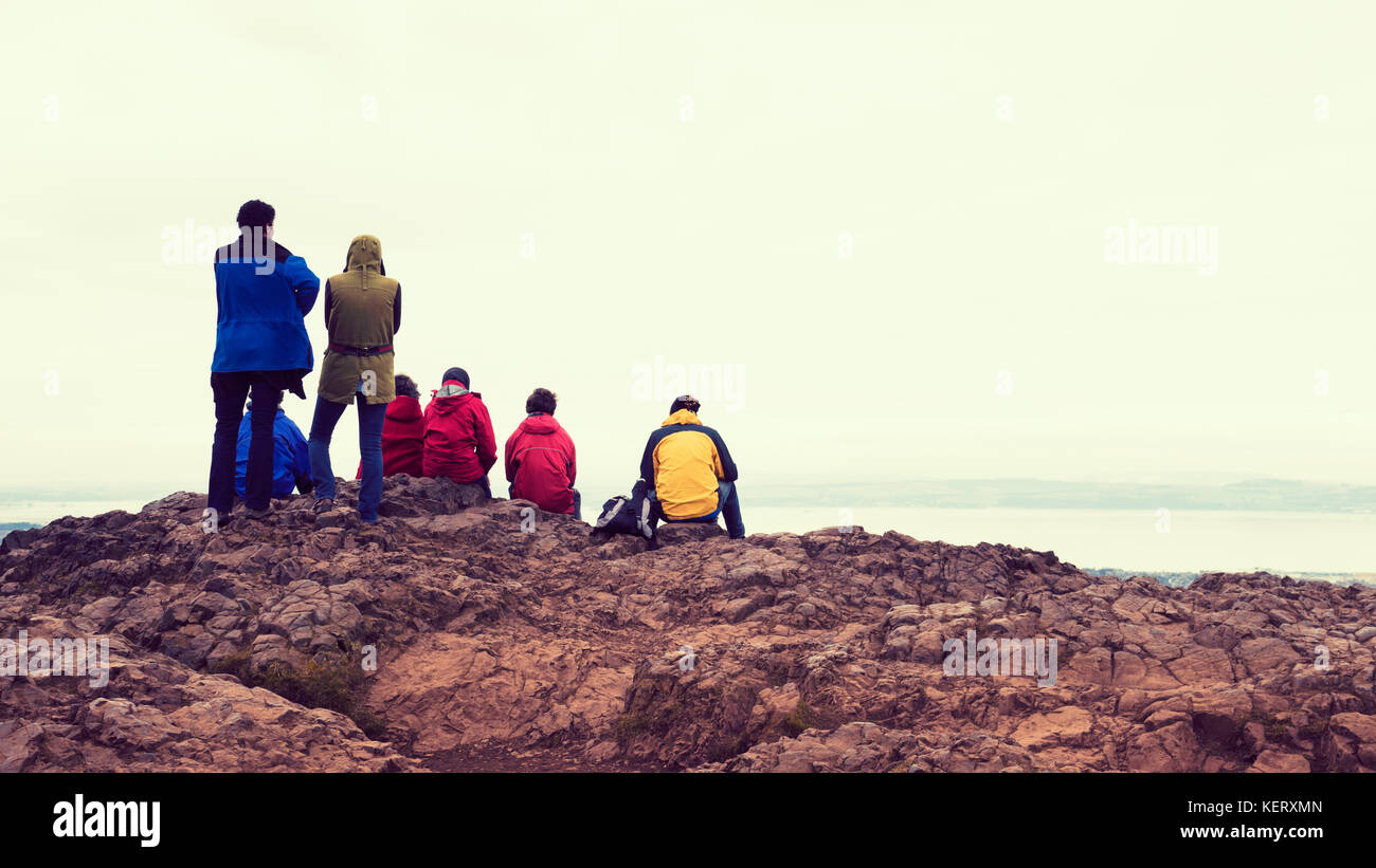 Family enjoying view of Edinburgh from top of Arthurs seat, ancient ...