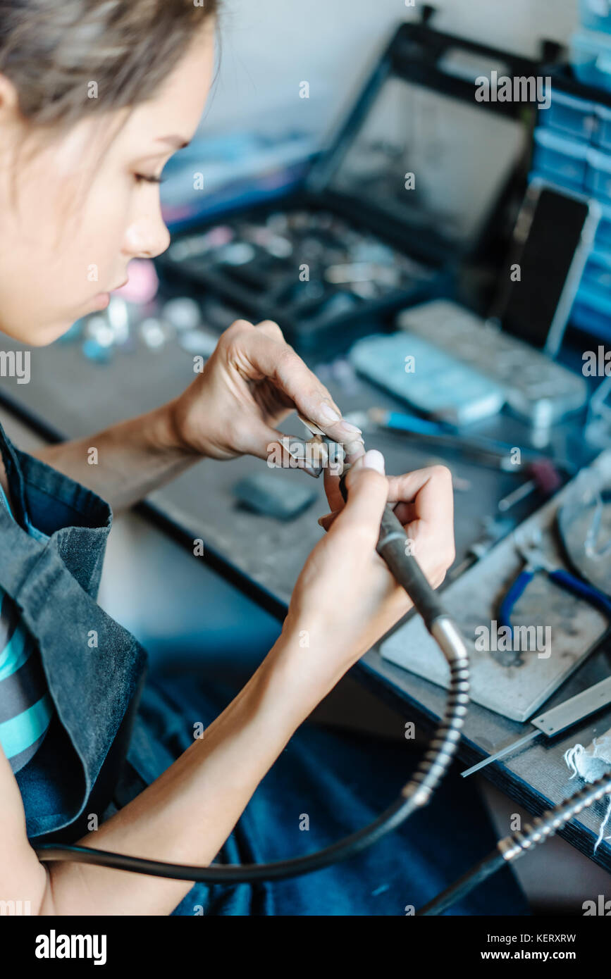 The girl is engaged in jewelry business Stock Photo - Alamy