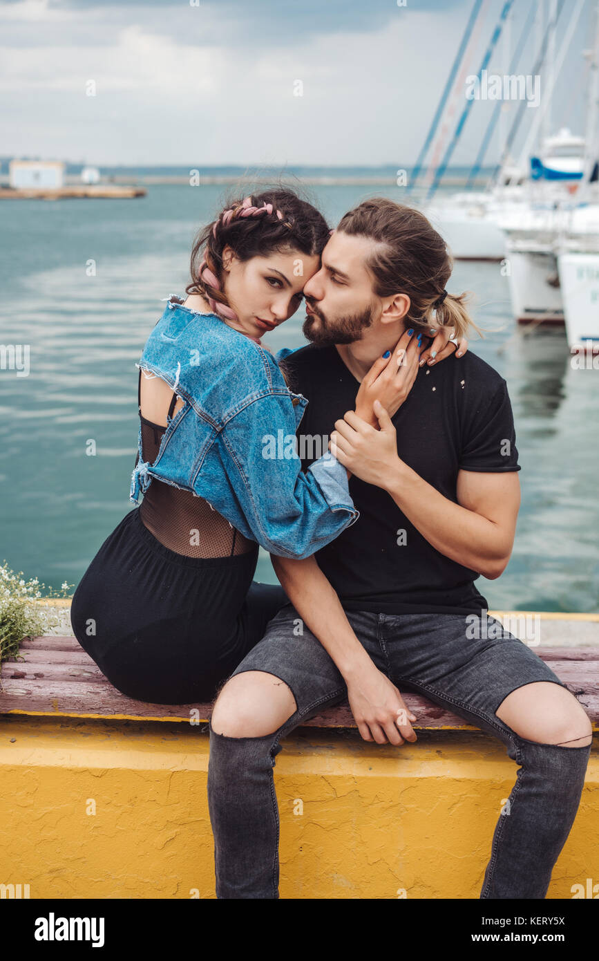 Guy and girl on pier Stock Photo - Alamy