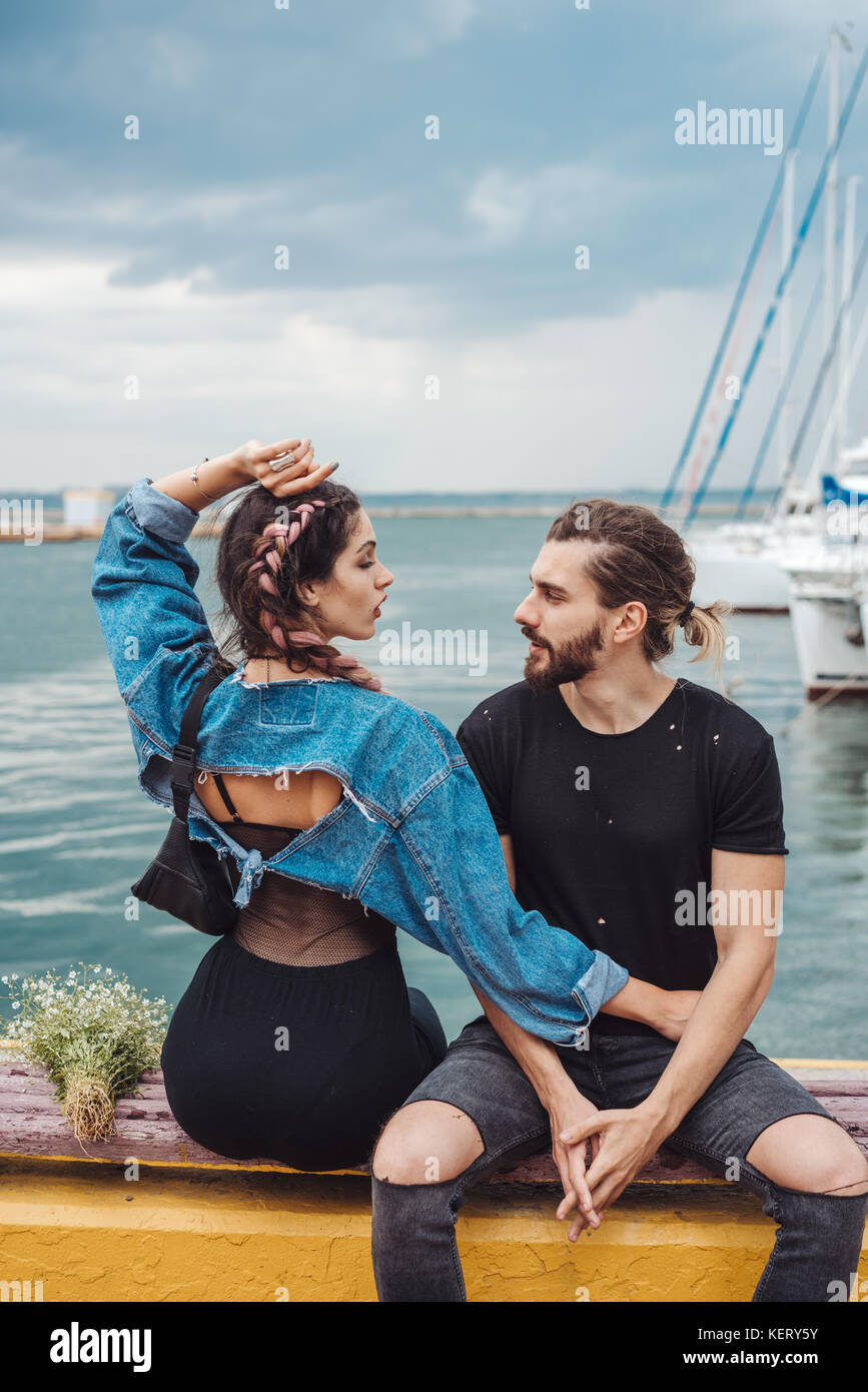 Guy and girl on pier Stock Photo - Alamy