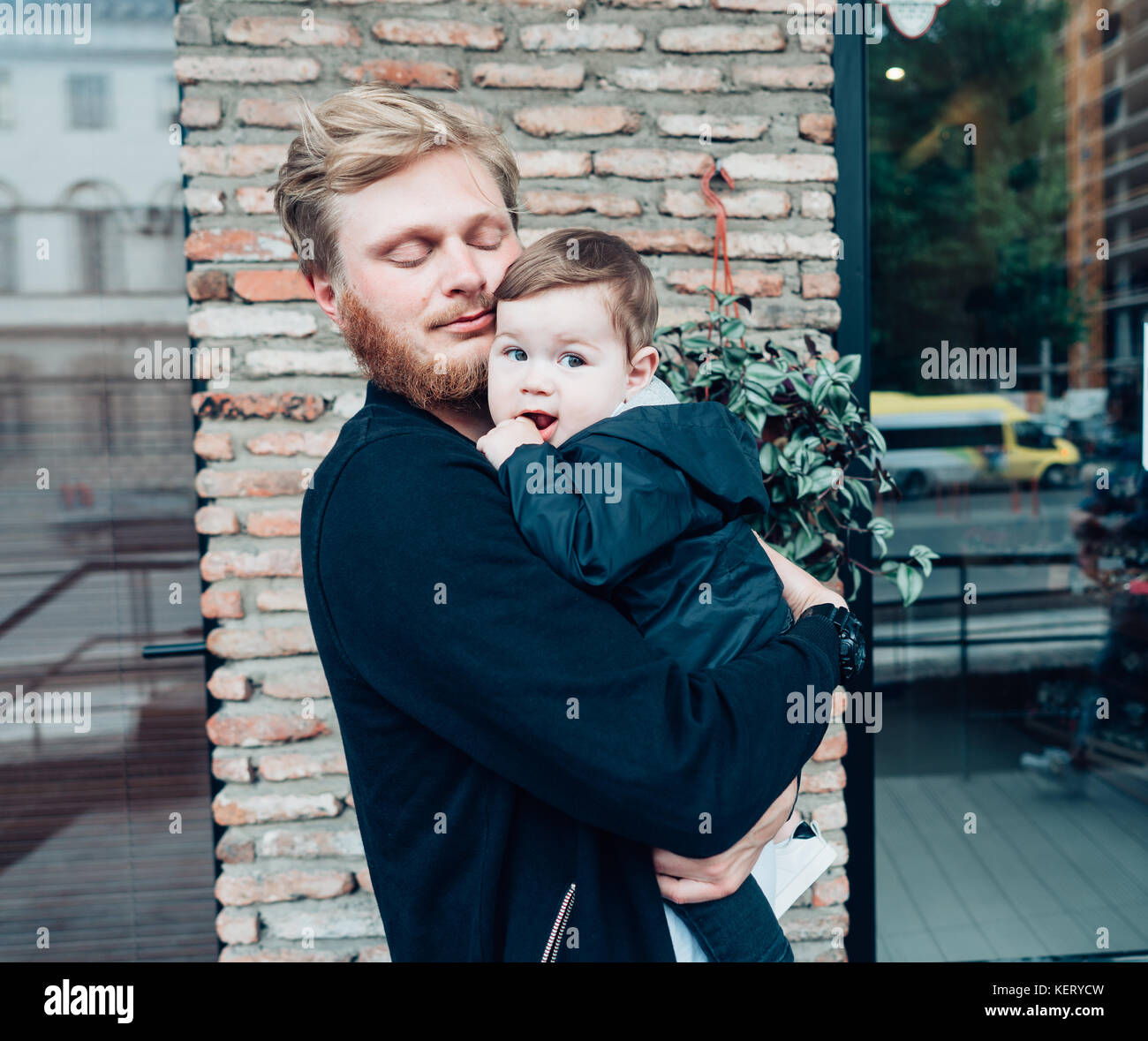 Dad with a small son in his arms Stock Photo - Alamy