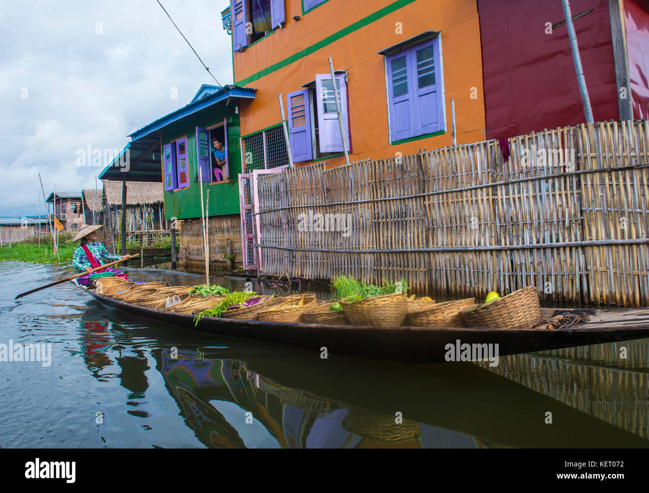 Intha woman on her boat in Inle lake Myanmar Stock Photo - Alamy