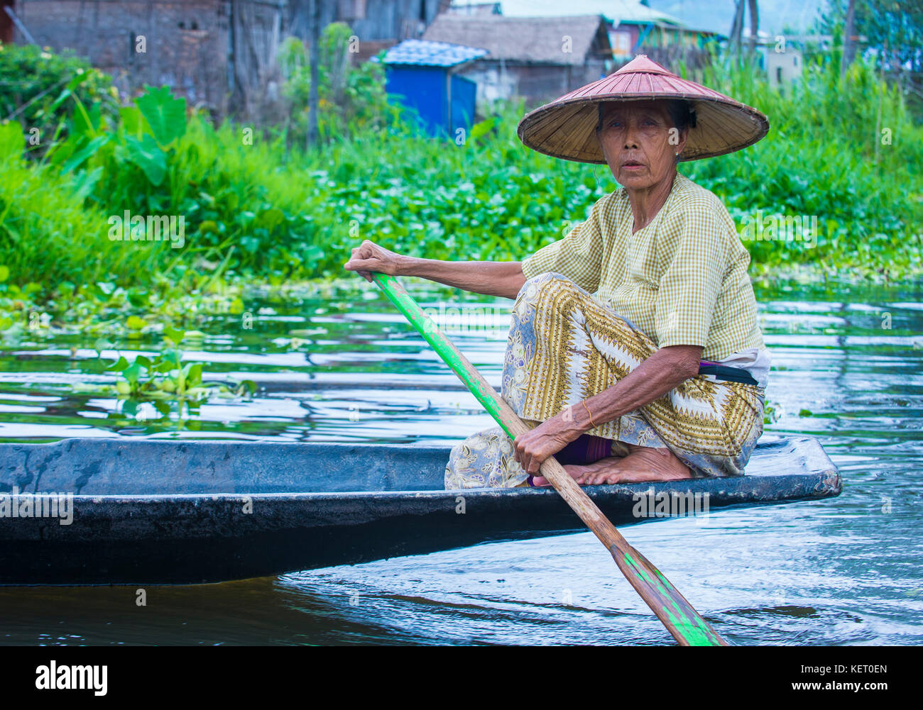 Intha woman on her boat in Inle lake Myanmar Stock Photo - Alamy