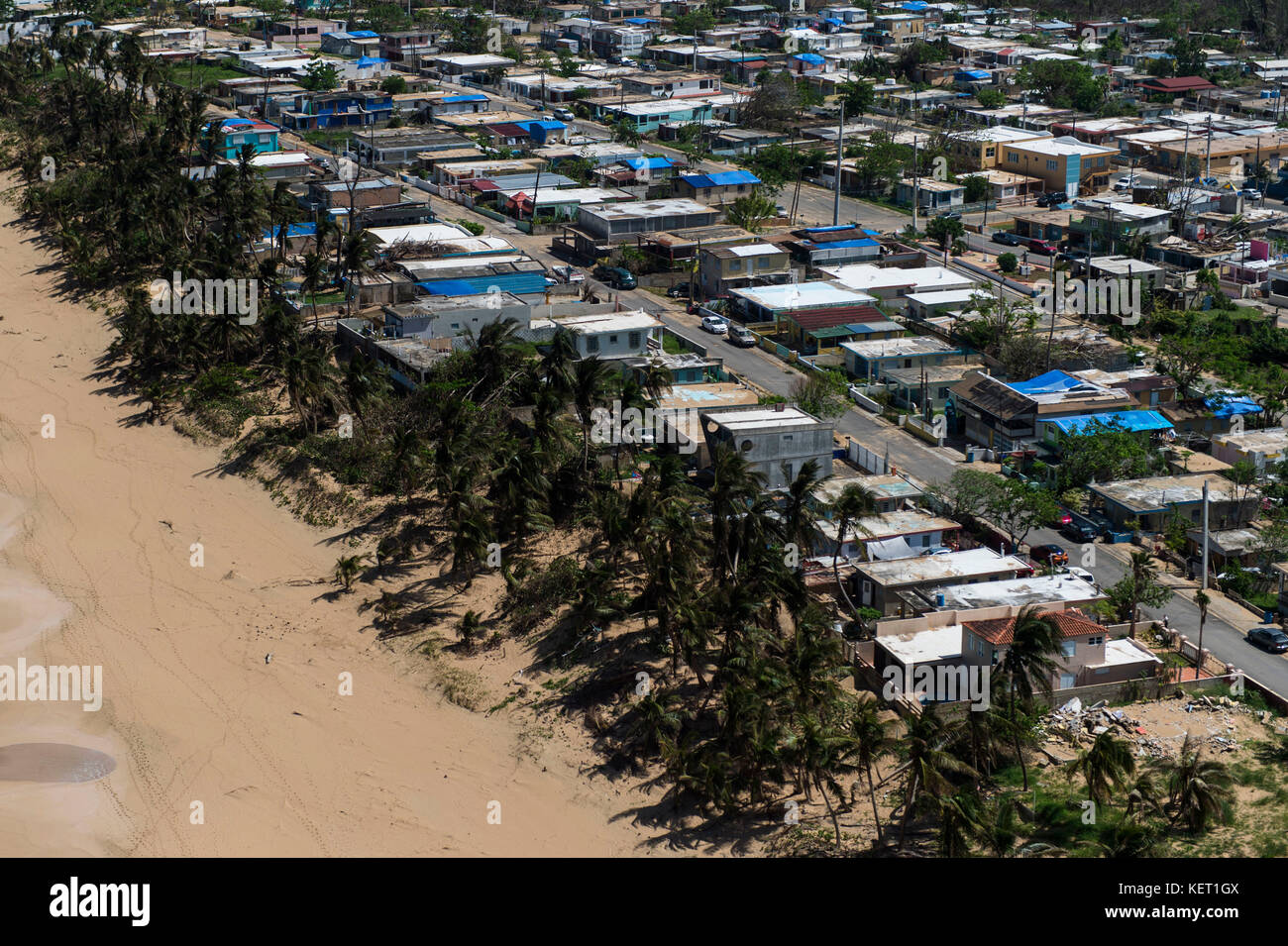 An aerial view of blue roofs on homes that the U.S. Army Corps of ...