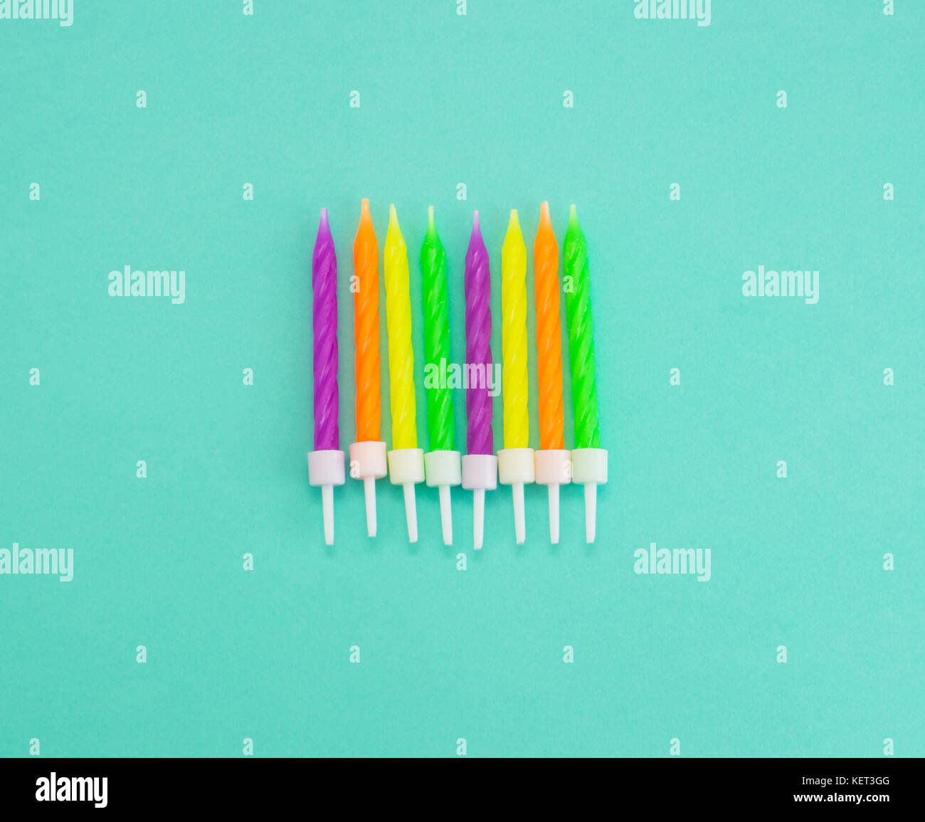birthday candles on mint background Stock Photo - Alamy