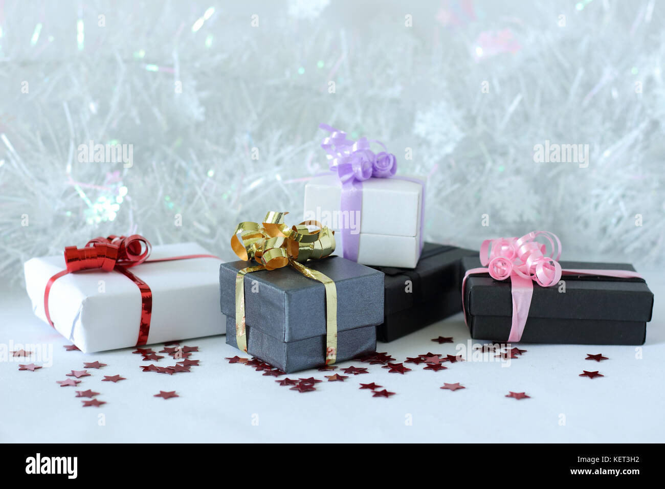 gifts with shiny bows on a Christmas party decor Stock Photo - Alamy