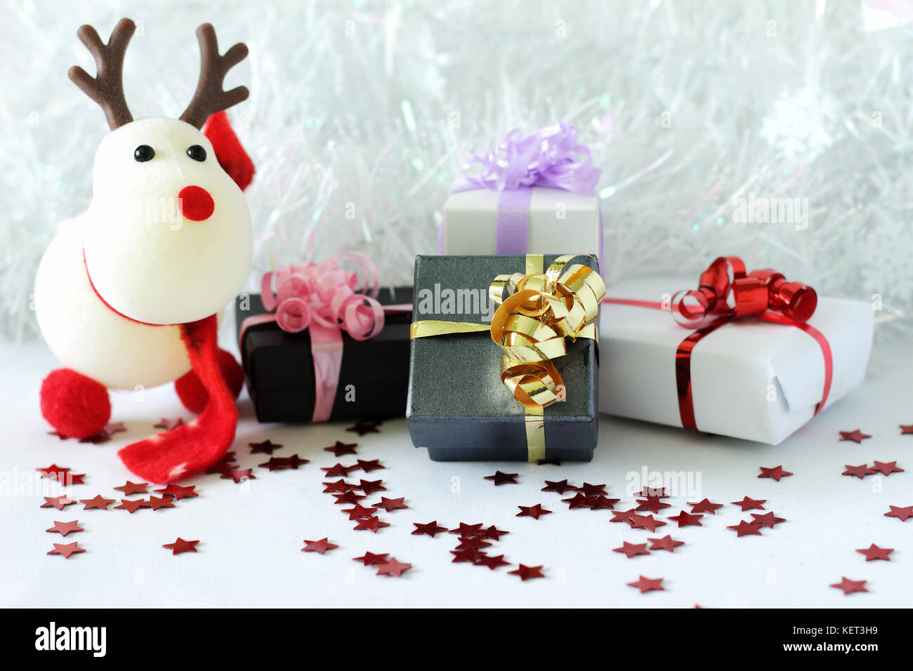 gifts with shiny bows on a Christmas party decor Stock Photo - Alamy