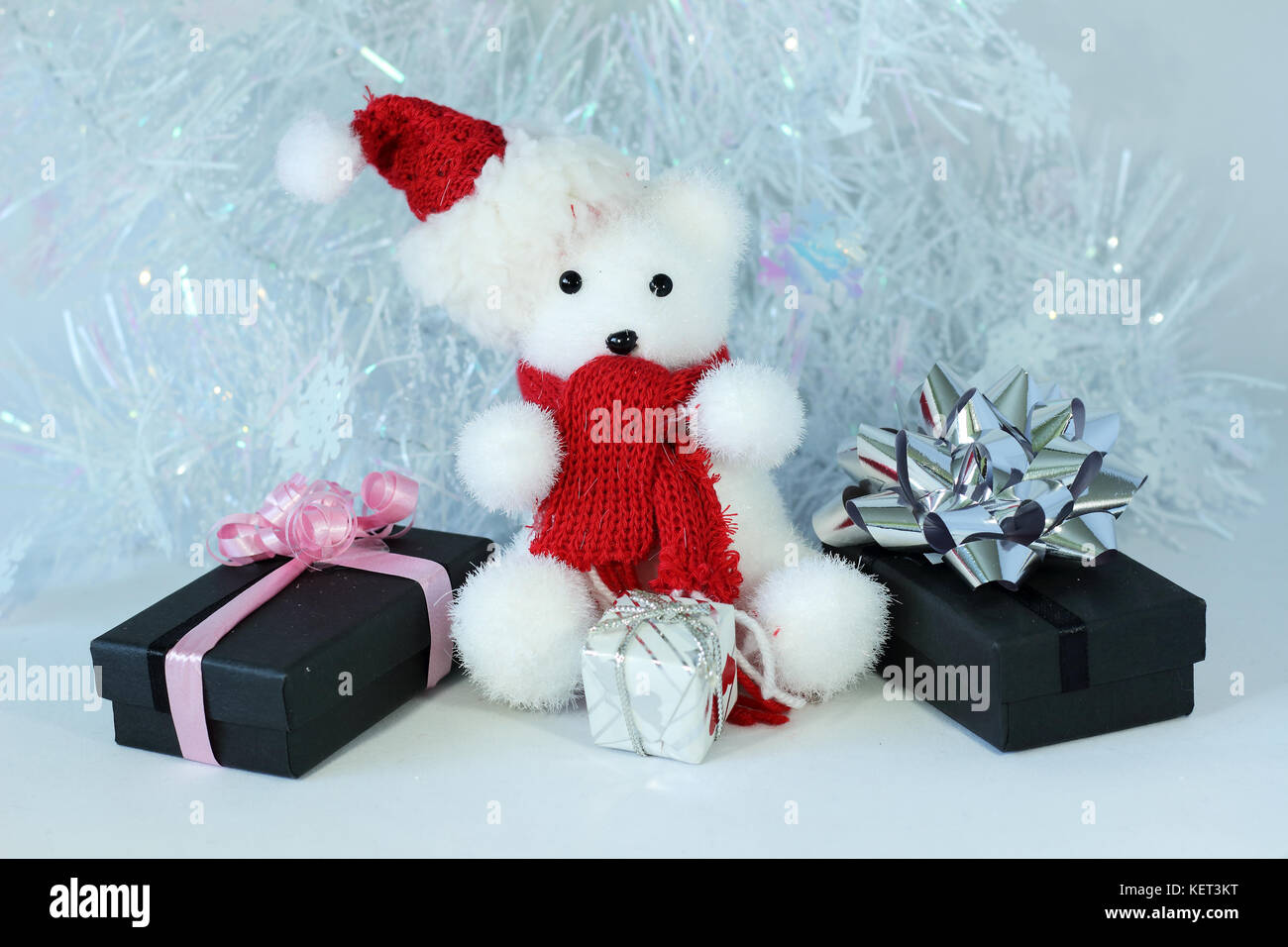gifts with shiny bows on a Christmas party decor Stock Photo - Alamy