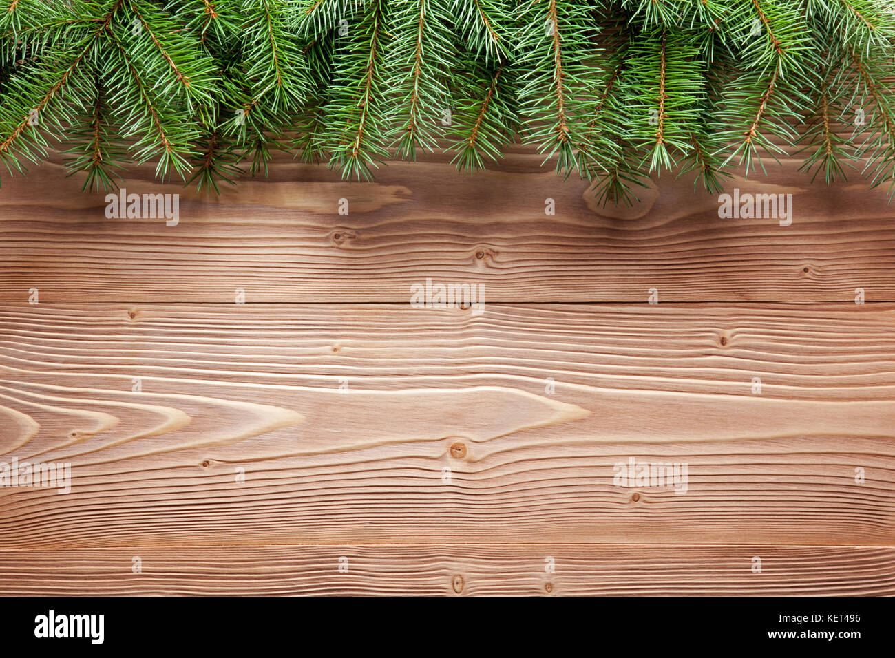 Christmas tree branches on wooden surface. Holiday background Stock ...