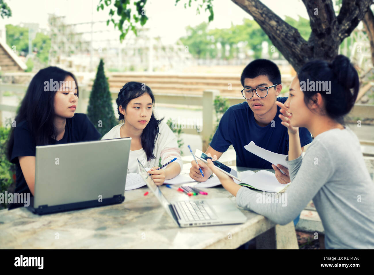 Asian Group of students sharing with the ideas for working on the ...