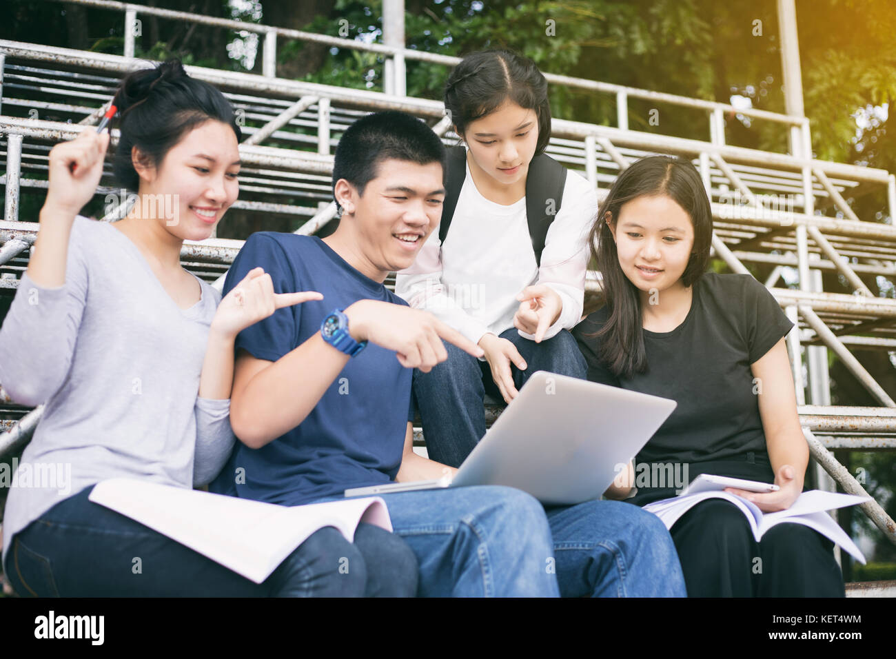 Asian Group of students sharing with the ideas for working on the ...